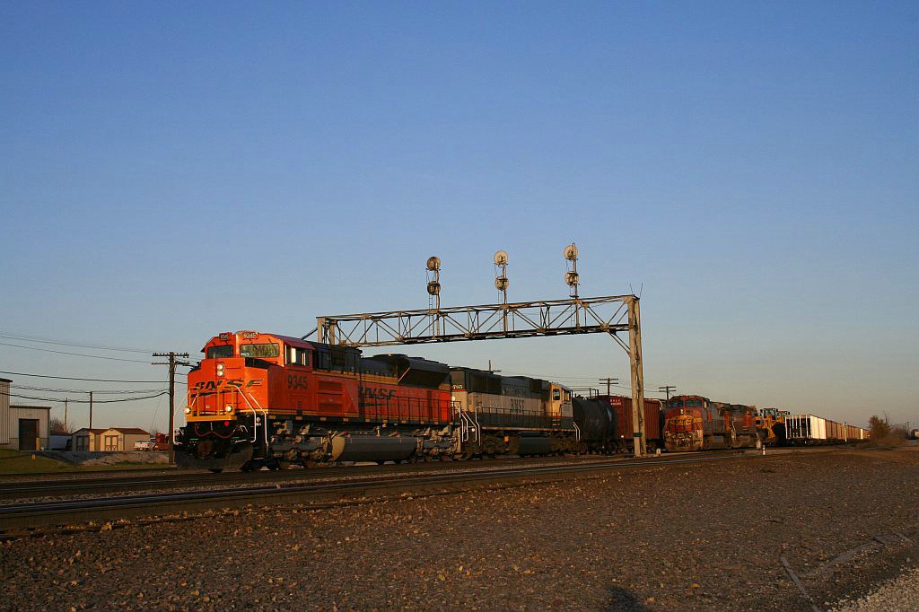 This is my first BNSF SD70ACe! 9345, with its low headlight, heads west through Aurora with M ...